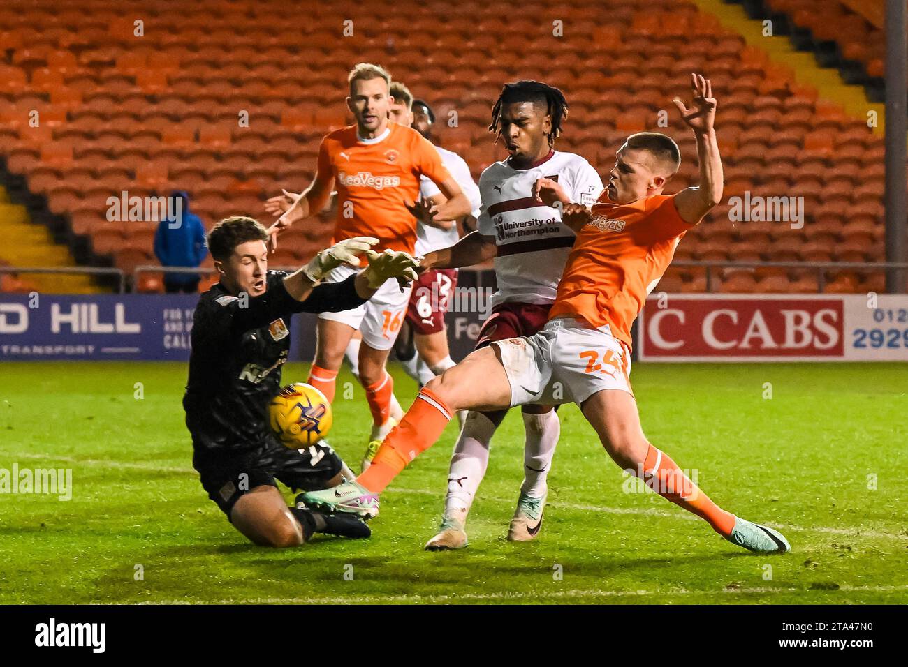 Andy Lyons #24 of Blackpool stretches for the ball but is saved by Max ...