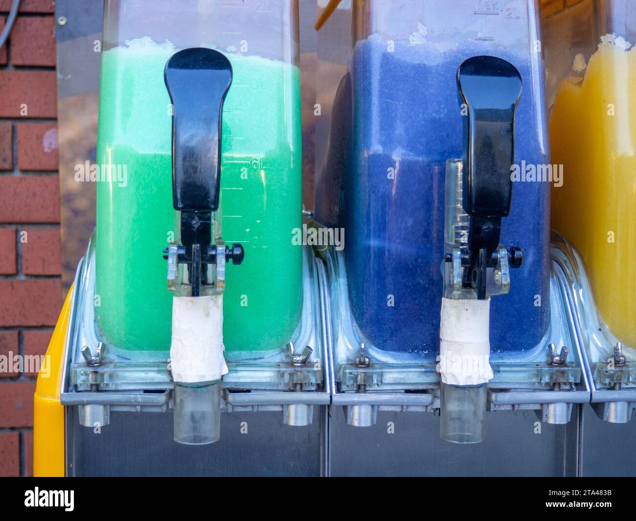 Vending machine with soft drinks and ice. Levers of a water machine ...