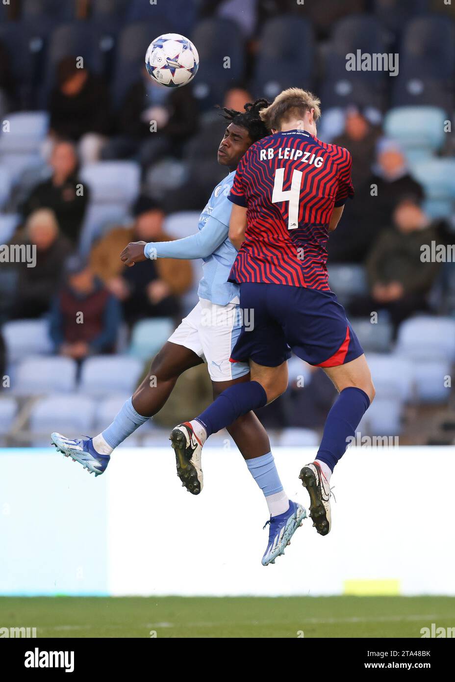 Manchester, UK. 28th Nov, 2023. Jonathan Norbye of RB Leipzig and Jaden ...