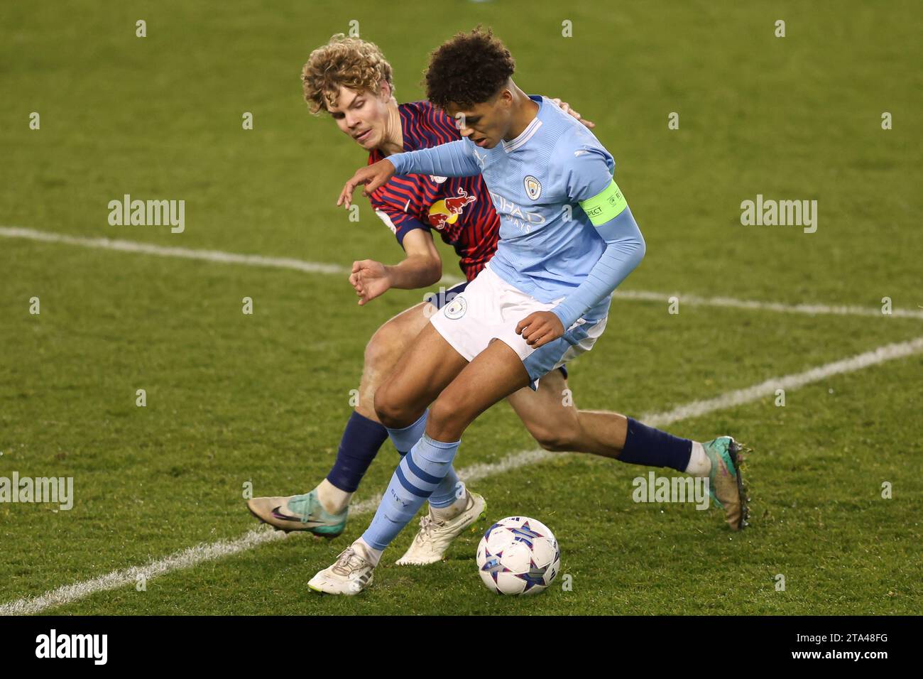 Manchester, UK. 28th Nov, 2023. Max Alleyne of Manchester City and Tino ...