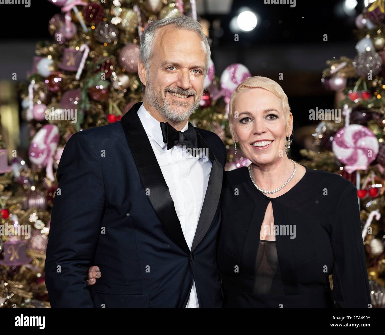 Ed Sinclair, left, and Olivia Colman pose for photographers upon ...