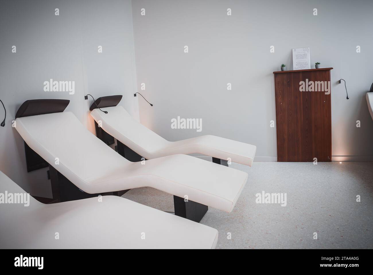 Minimalist White Lounge Chairs in Serene Spa-Like Room for Relaxation ...