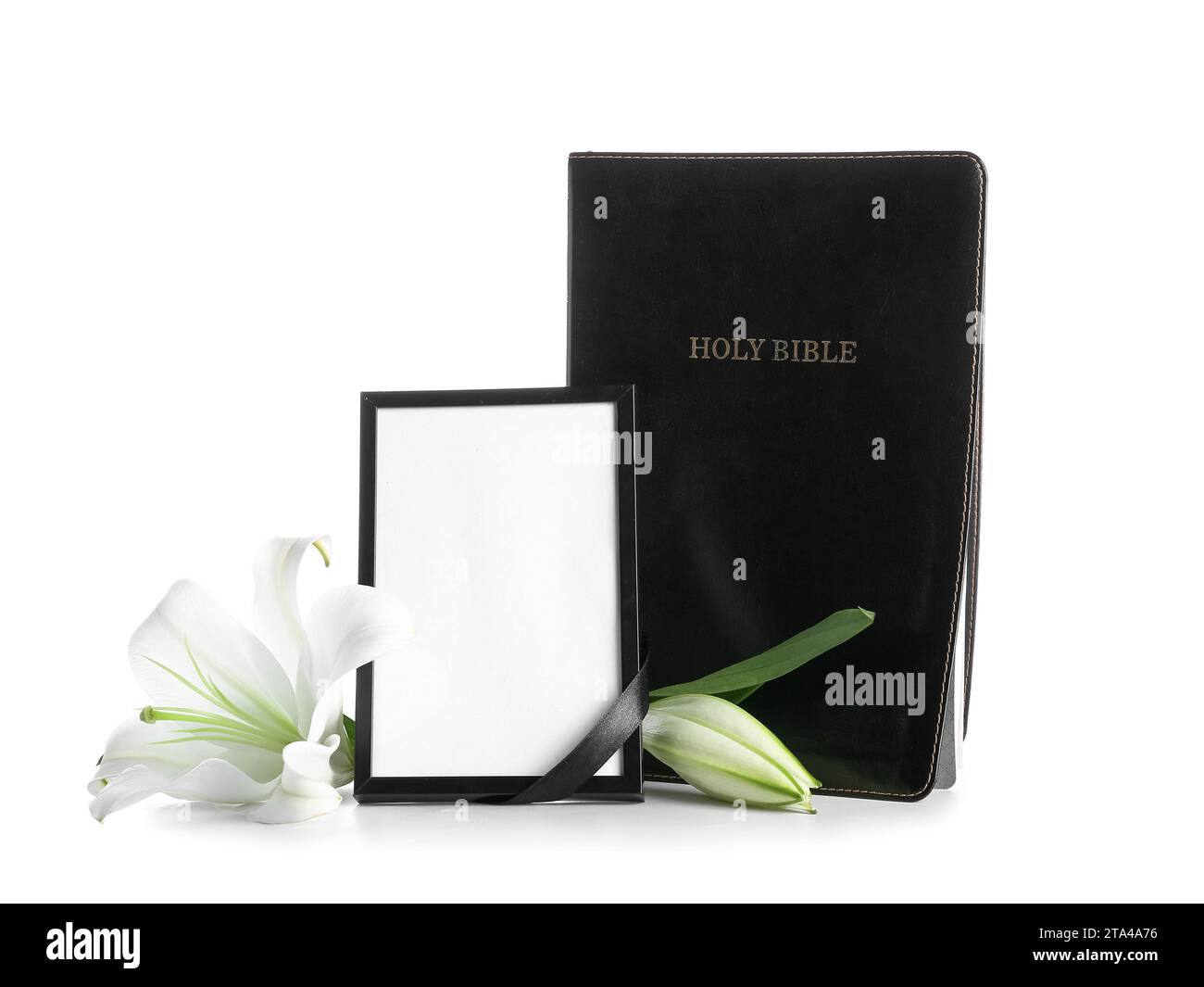 Blank photo frame with lily flower and Bible on white background Stock ...