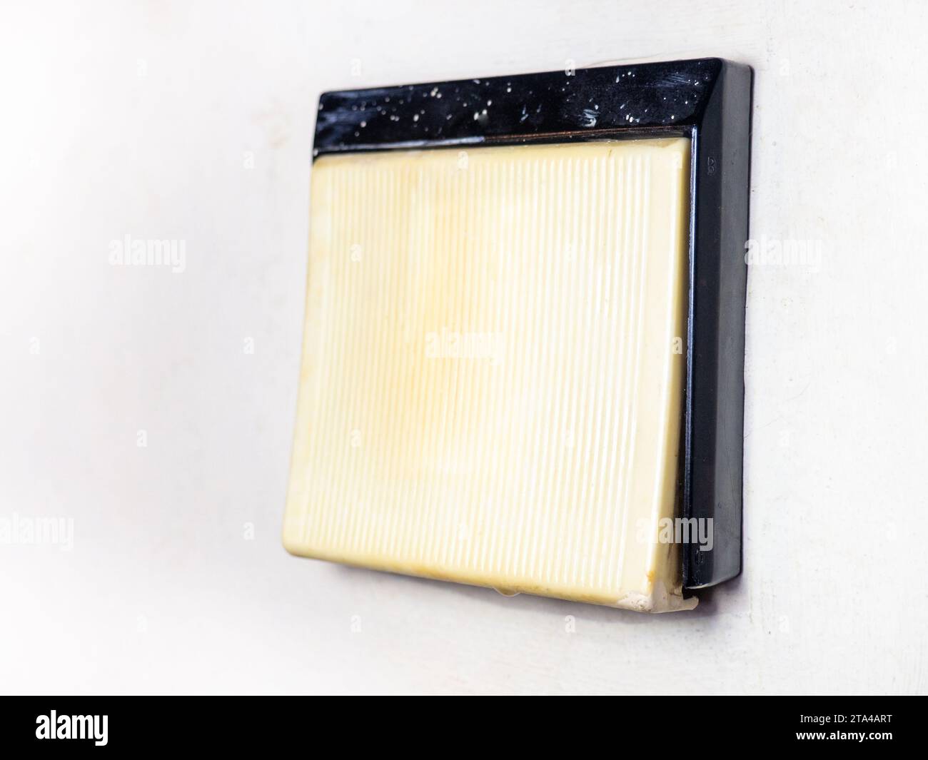 Old plastic wall light switch. Vintage device. Part of home interior ...