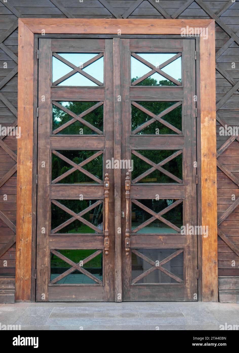Wooden heavy doors to an old theater. Entrance to a pompous building ...
