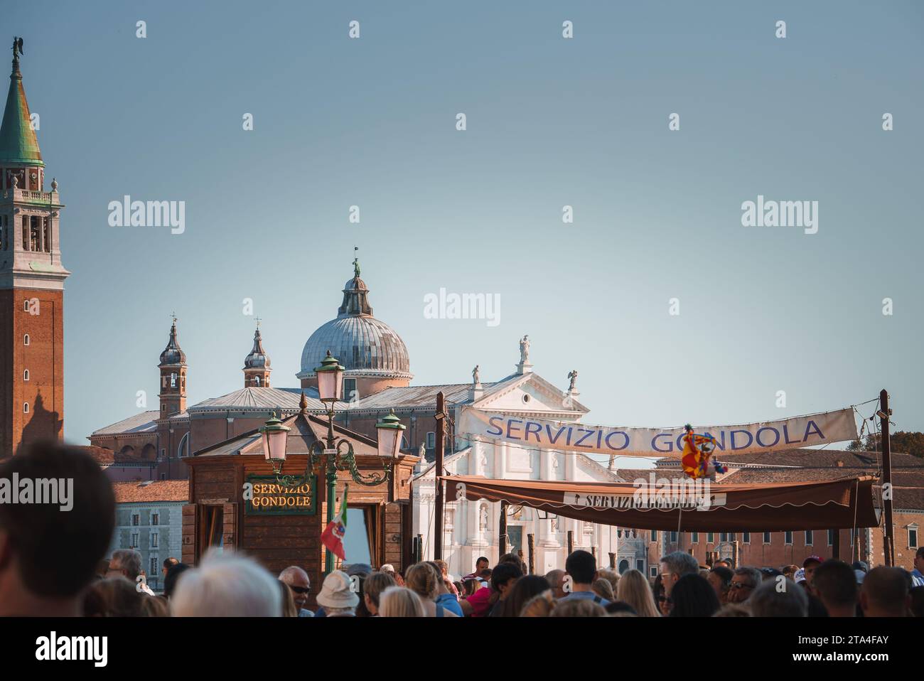 Summer Festivities: Lively Crowd Gathers in Front of Building in Venice ...