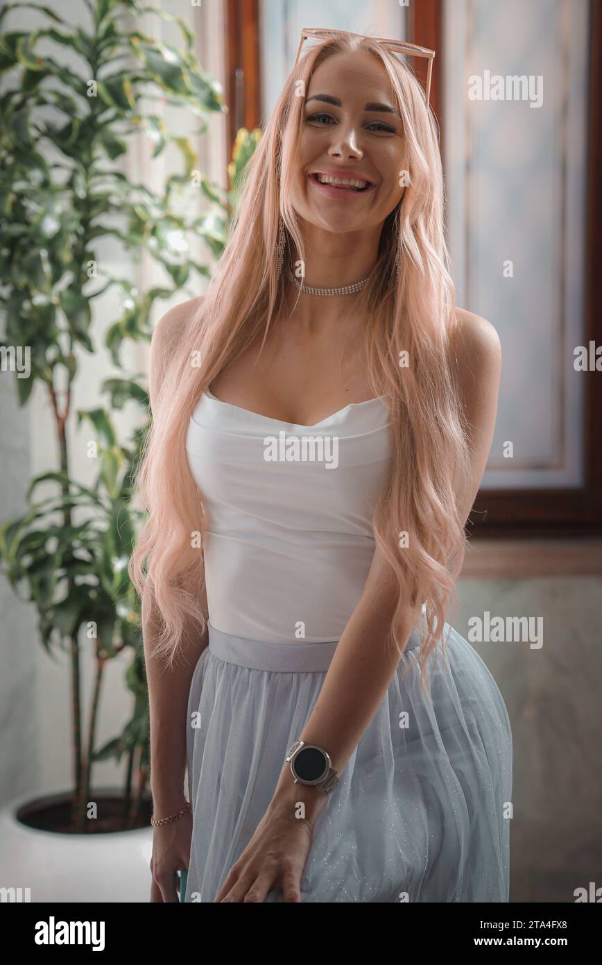 Beautiful woman in blue top hi-res stock photography and images - Alamy