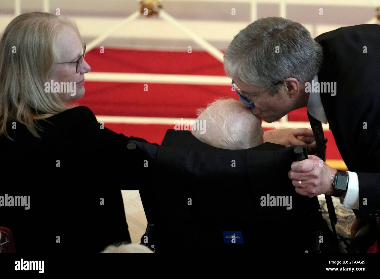 James "Chip" Carter kisses his father, former President Jimmy Carter ...