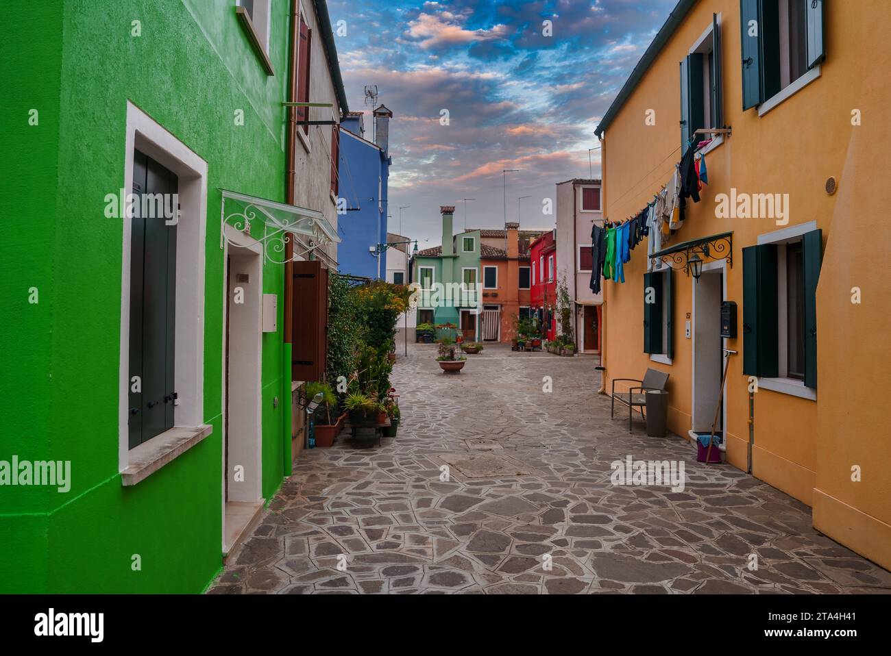Vibrant Street Scene in Burano, Italy: Colorful Buildings and Lively ...