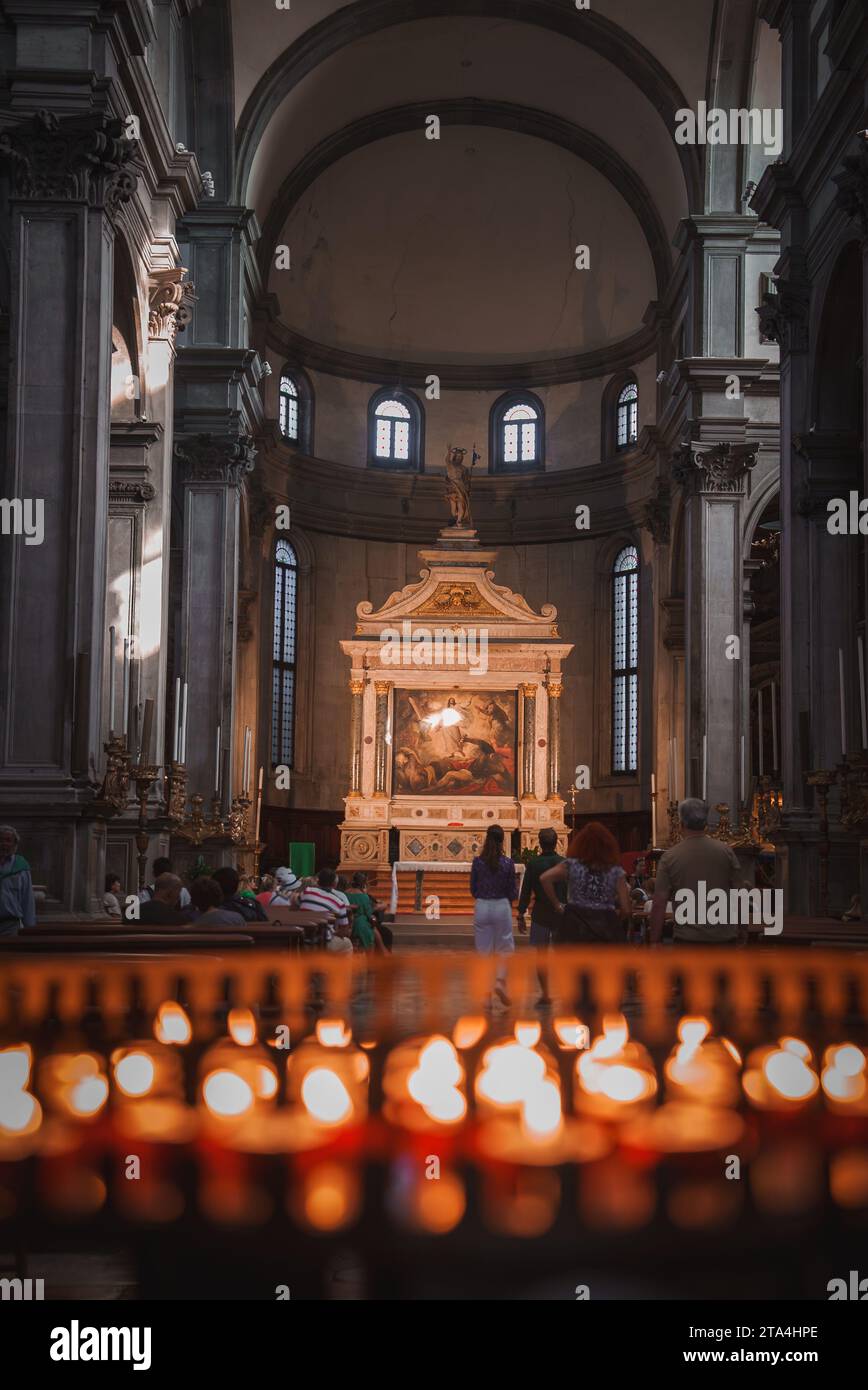 Venetian Church Interior with Lit Candles Creating a Solemn and ...