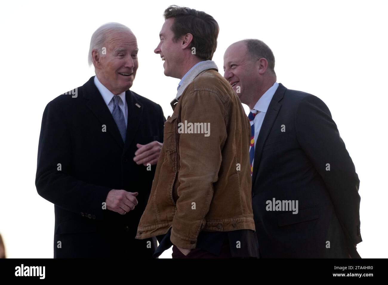 President Joe Biden greets Colorado Gov. Jared Polis, right, and Denver ...