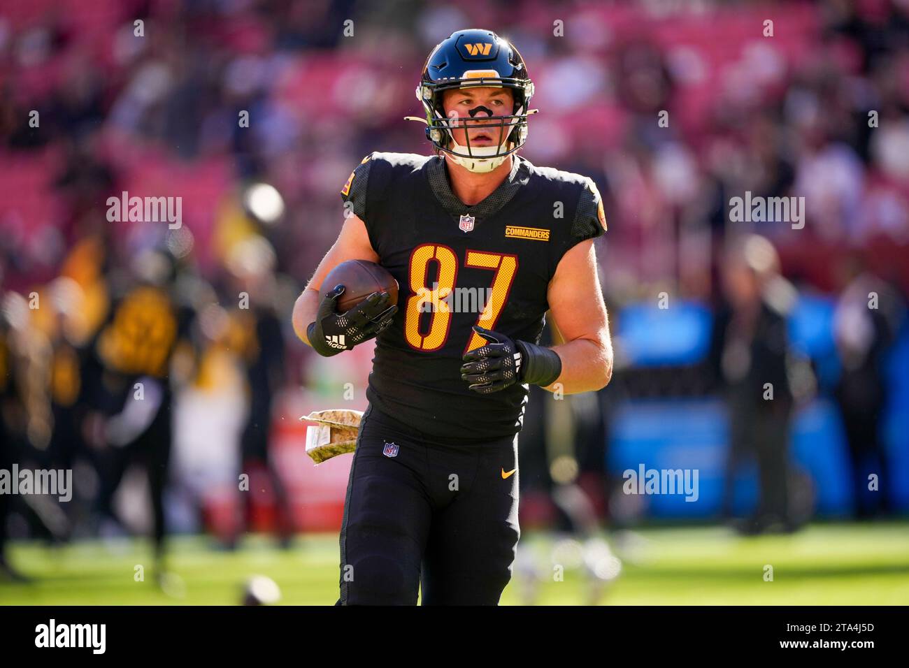 Washington Commanders tight end John Bates warms up before an NFL ...