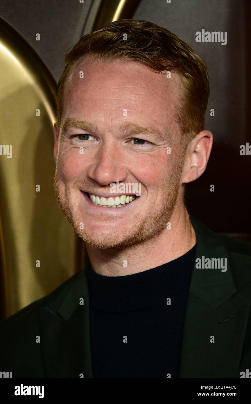 London, UK. 28th Nov, 2023. Greg Rutherford and guest attends the ...