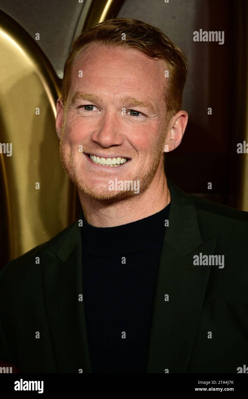 London, UK. 28th Nov, 2023. Greg Rutherford and guest attends the ...