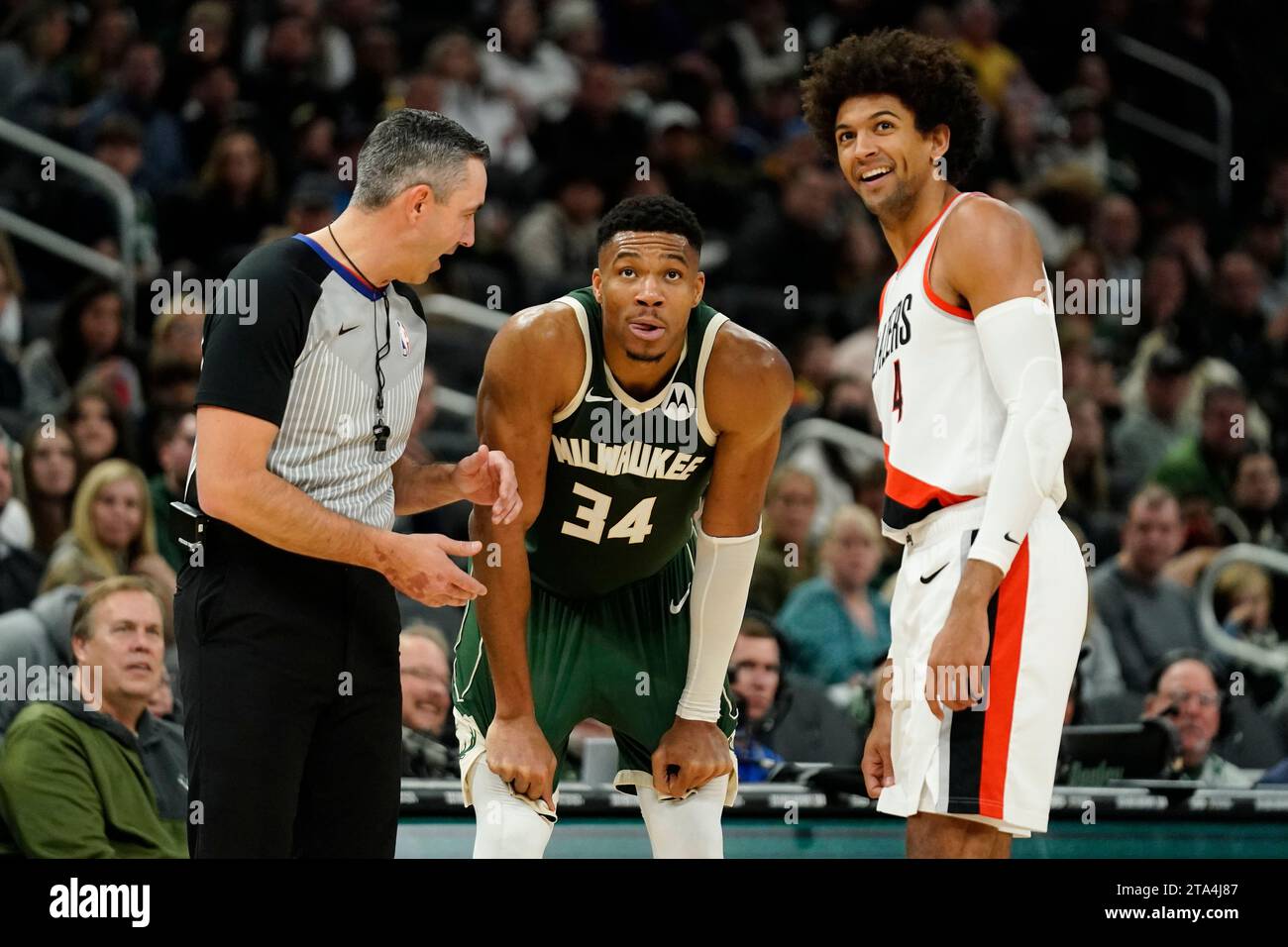 Milwaukee Bucks' Giannis Antetokounmpo (34) talks with an official as ...