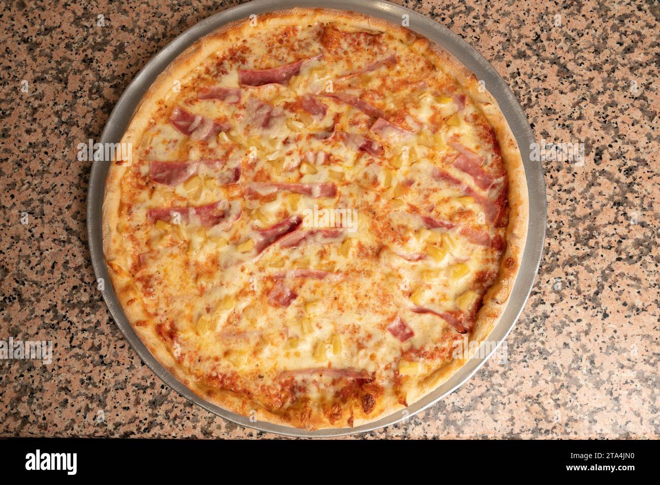 Pineapple and ham pizza Stock Photo - Alamy