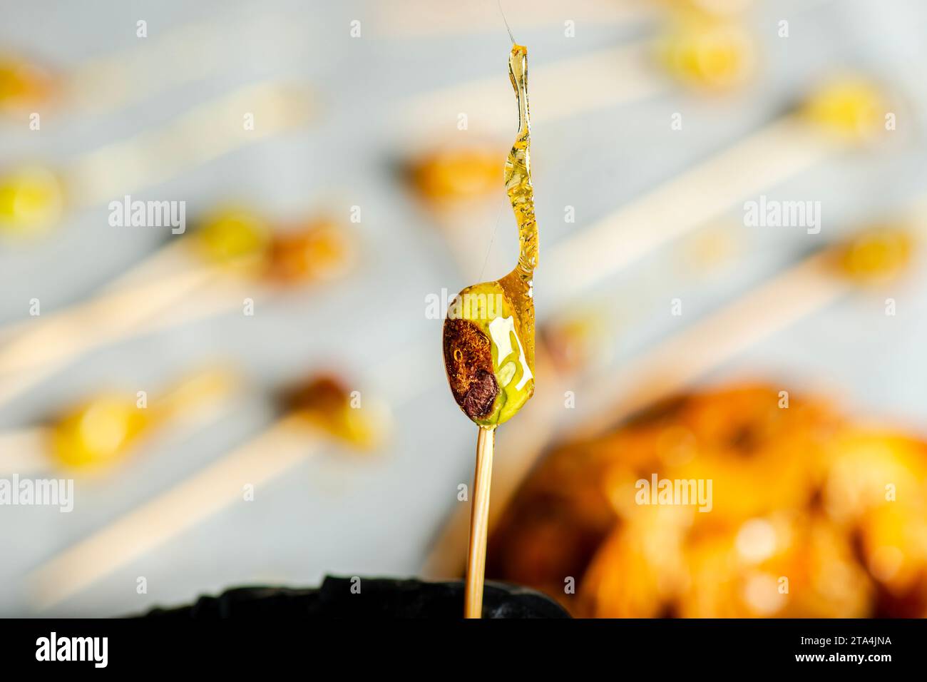 In the kitchen showing the process of caramelising pistachios for ...