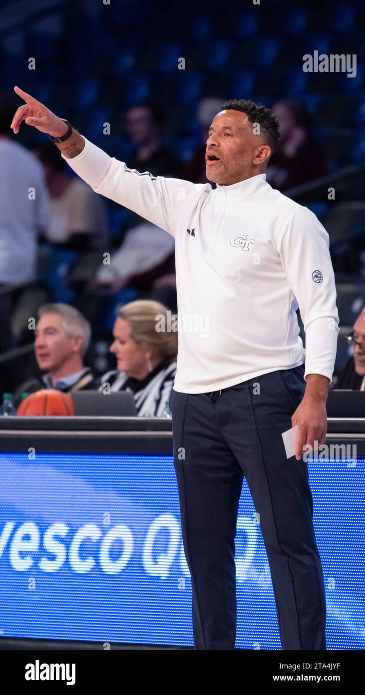 Georgia Tech head coach Damon Stoudamire points in the first half of an ...