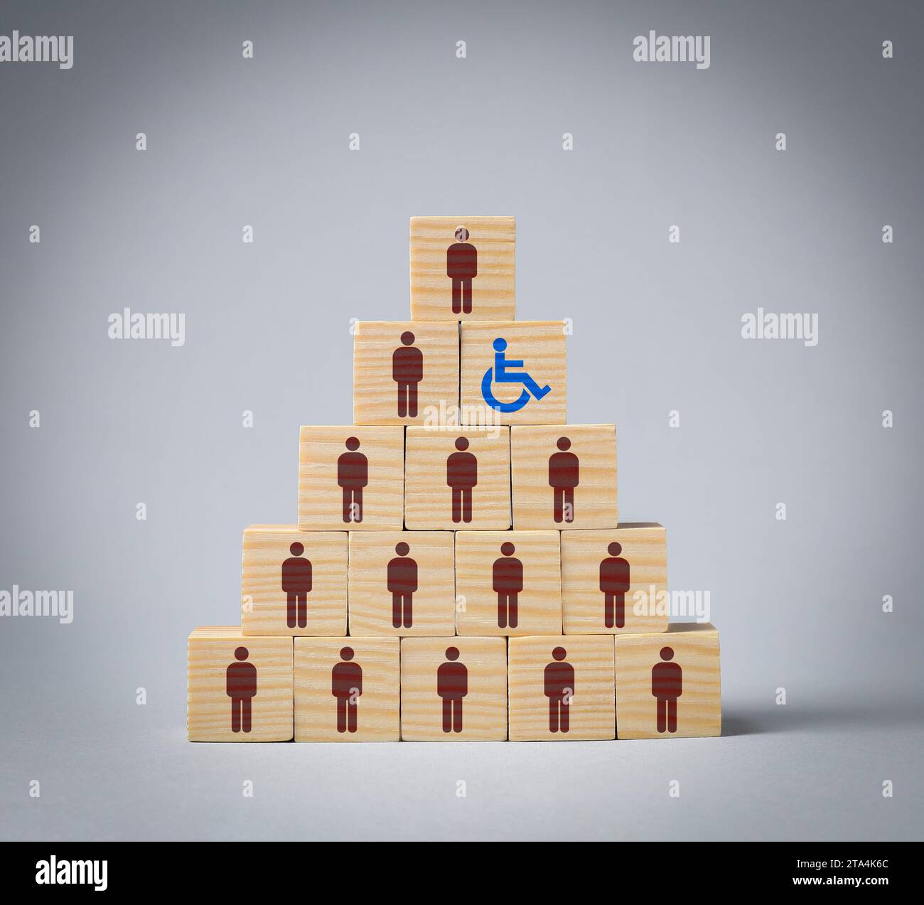 Inclusive workplace culture. Pyramid of wooden cubes with human icons ...