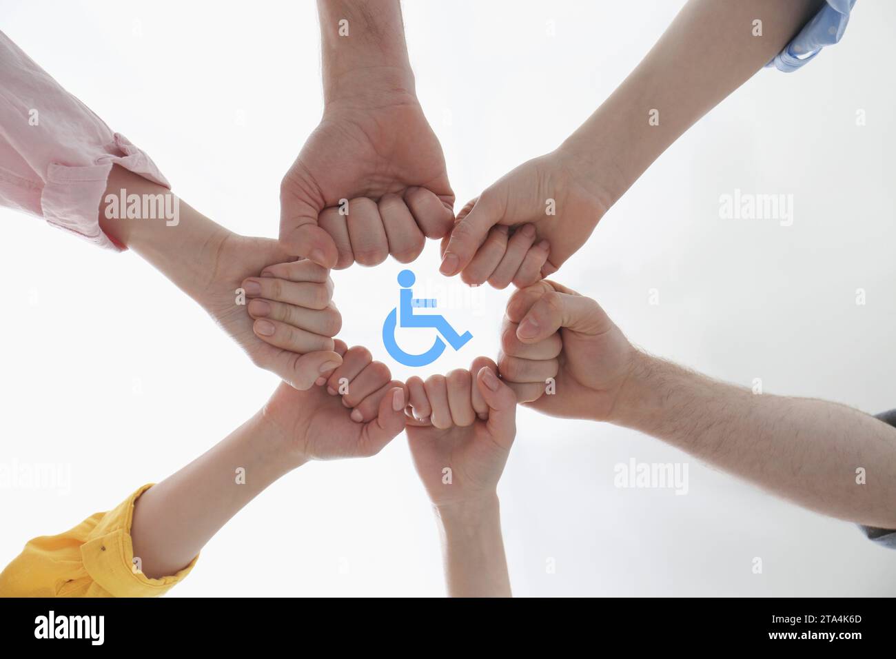 Inclusion concept. People holding fists together around international ...