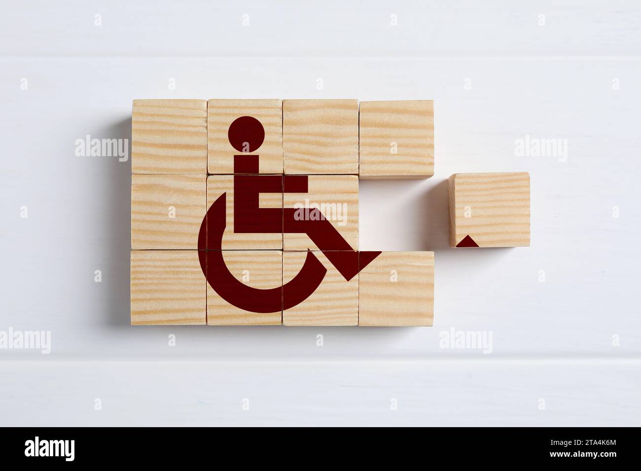 Inclusion concept. Making international symbol of access with wooden ...