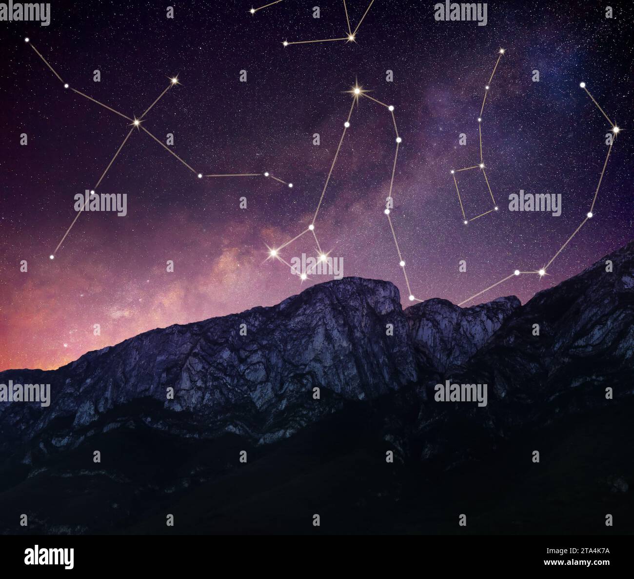 Different constellations in starry sky over mountains at night Stock ...