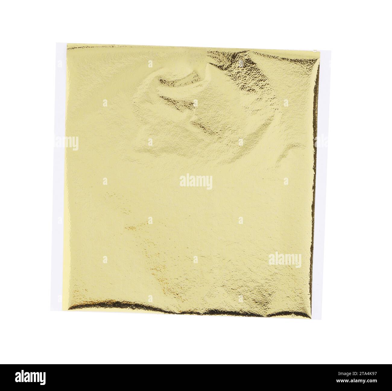 Edible gold leaf sheet isolated on white Stock Photo - Alamy