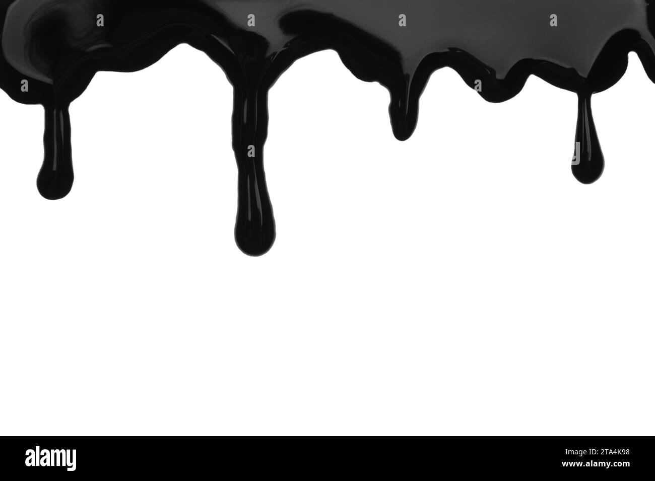 Black viscous liquid flowing on white background Stock Photo - Alamy