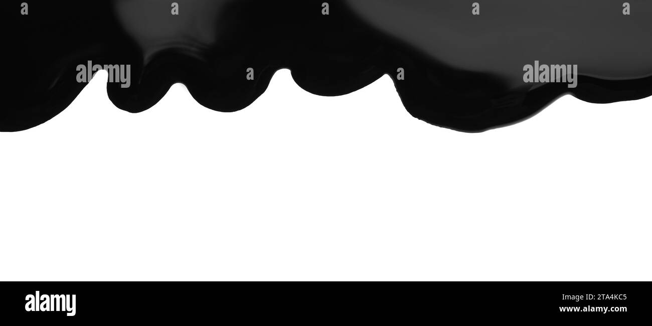 Black viscous liquid flowing on white background Stock Photo - Alamy
