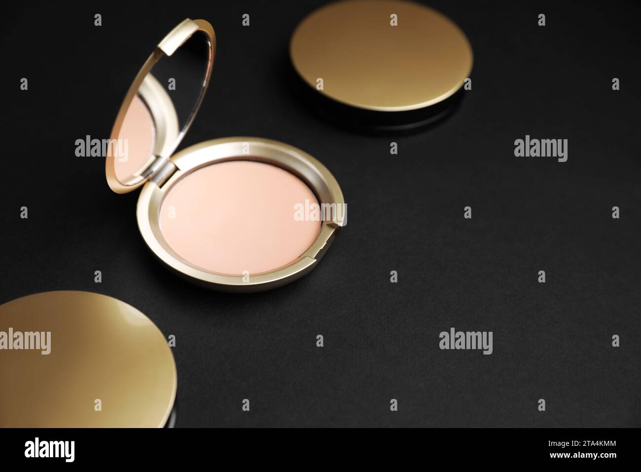 Face powders on black background, space for text Stock Photo - Alamy