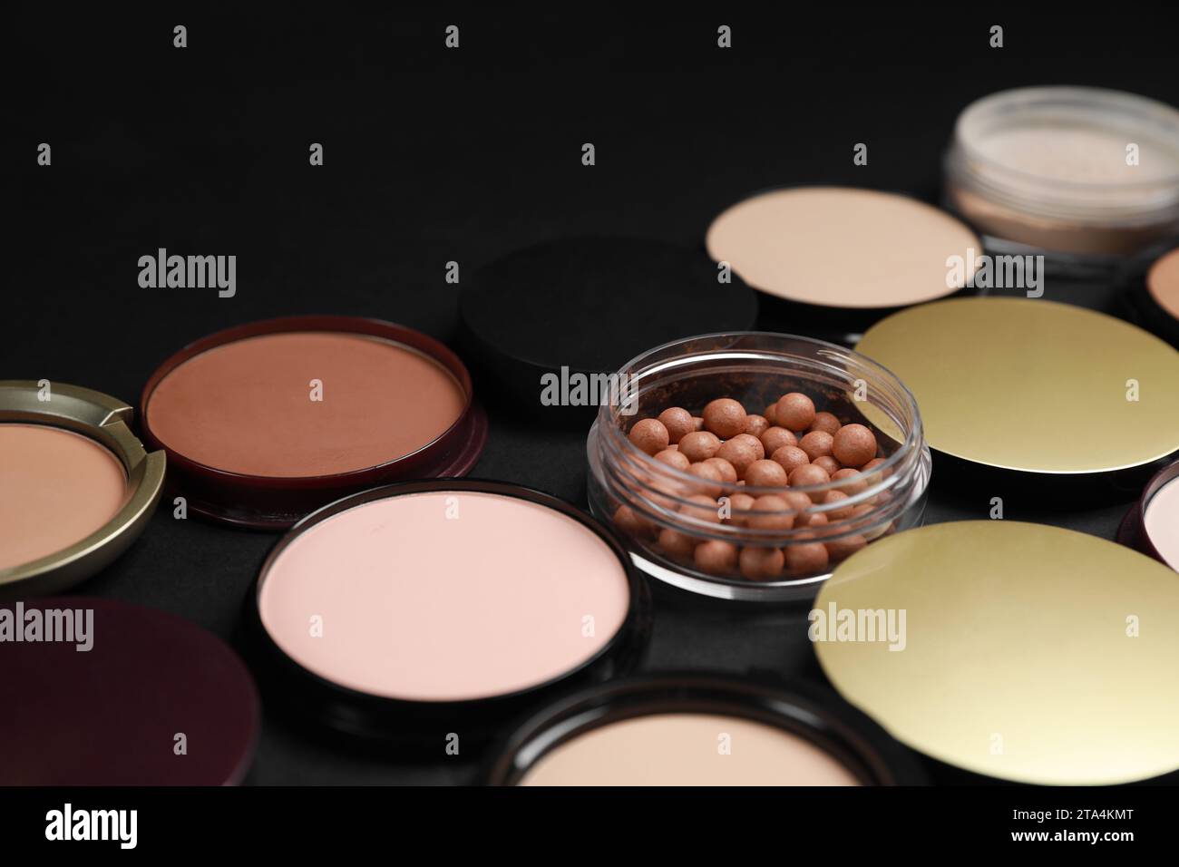 Different face powders on black background, closeup Stock Photo - Alamy