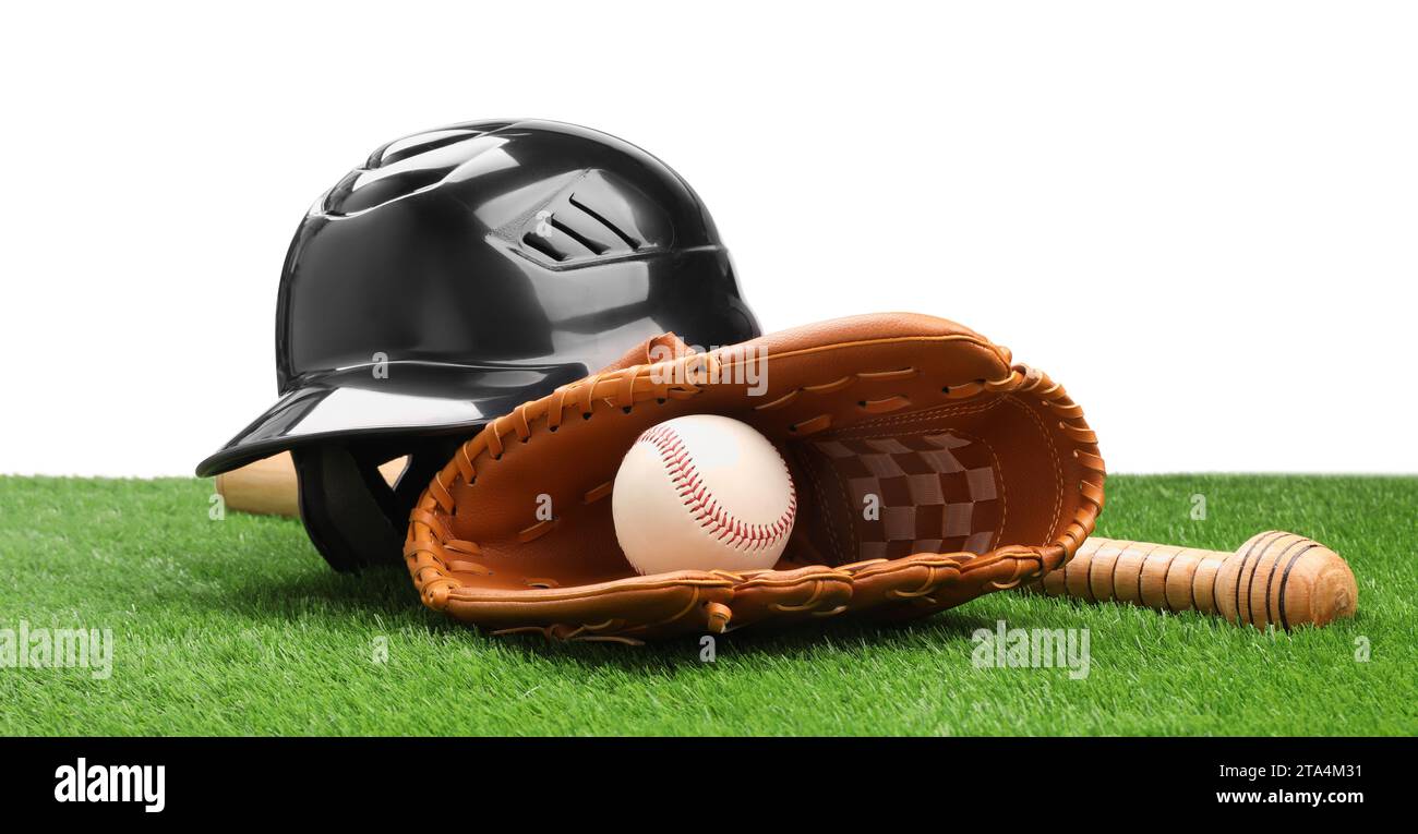 Baseball bat, ball, batting helmet and glove on artificial grass ...