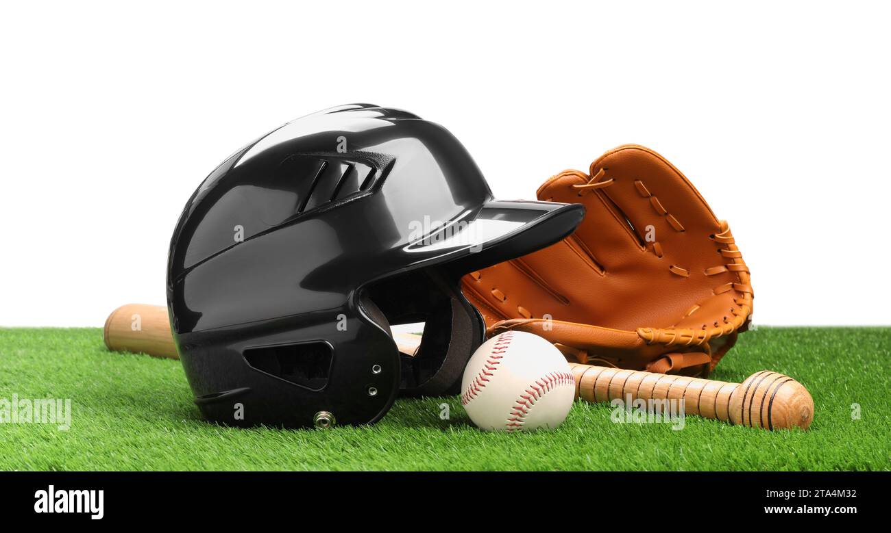 Baseball bat, ball, batting helmet and glove on artificial grass ...