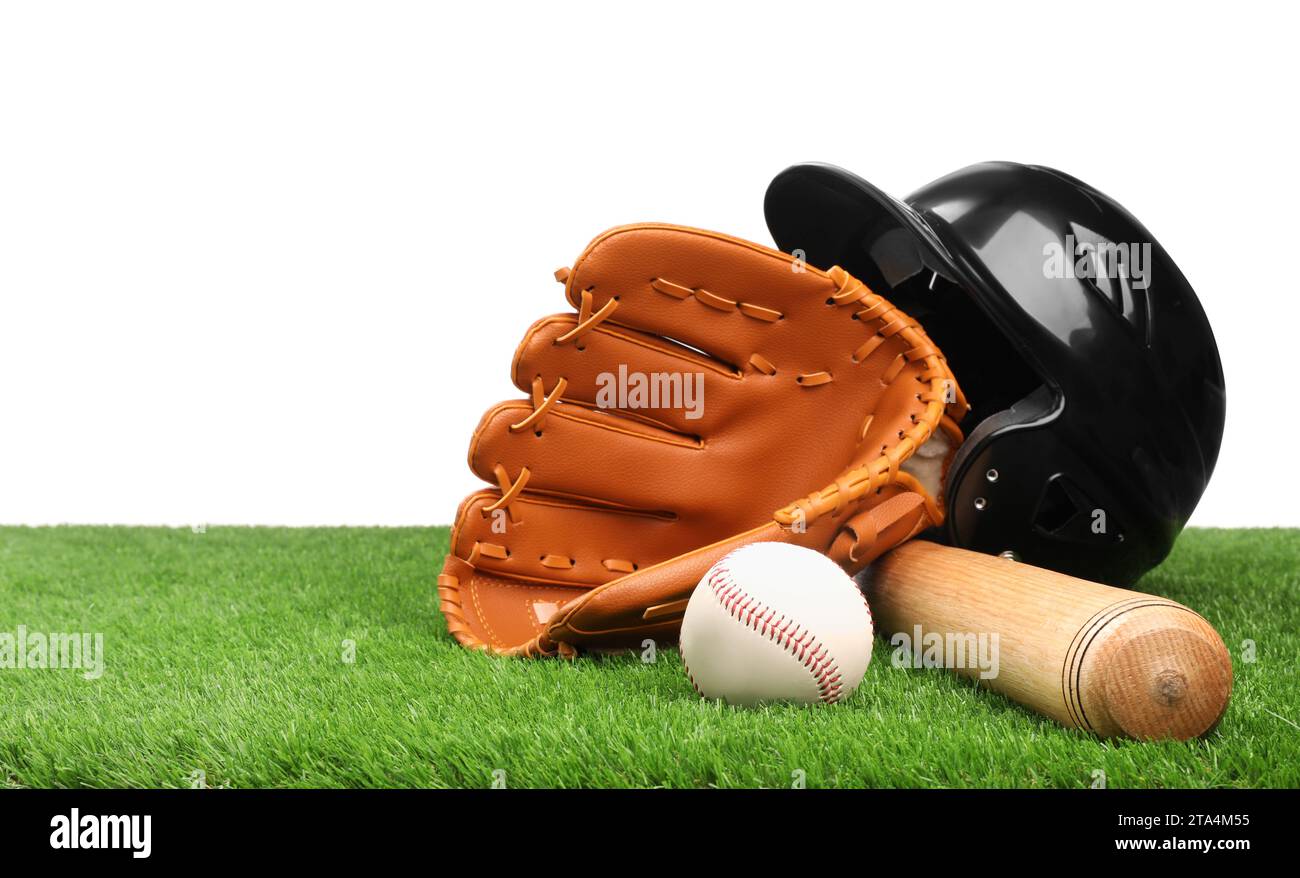 Baseball bat, ball, batting helmet and glove on artificial grass ...