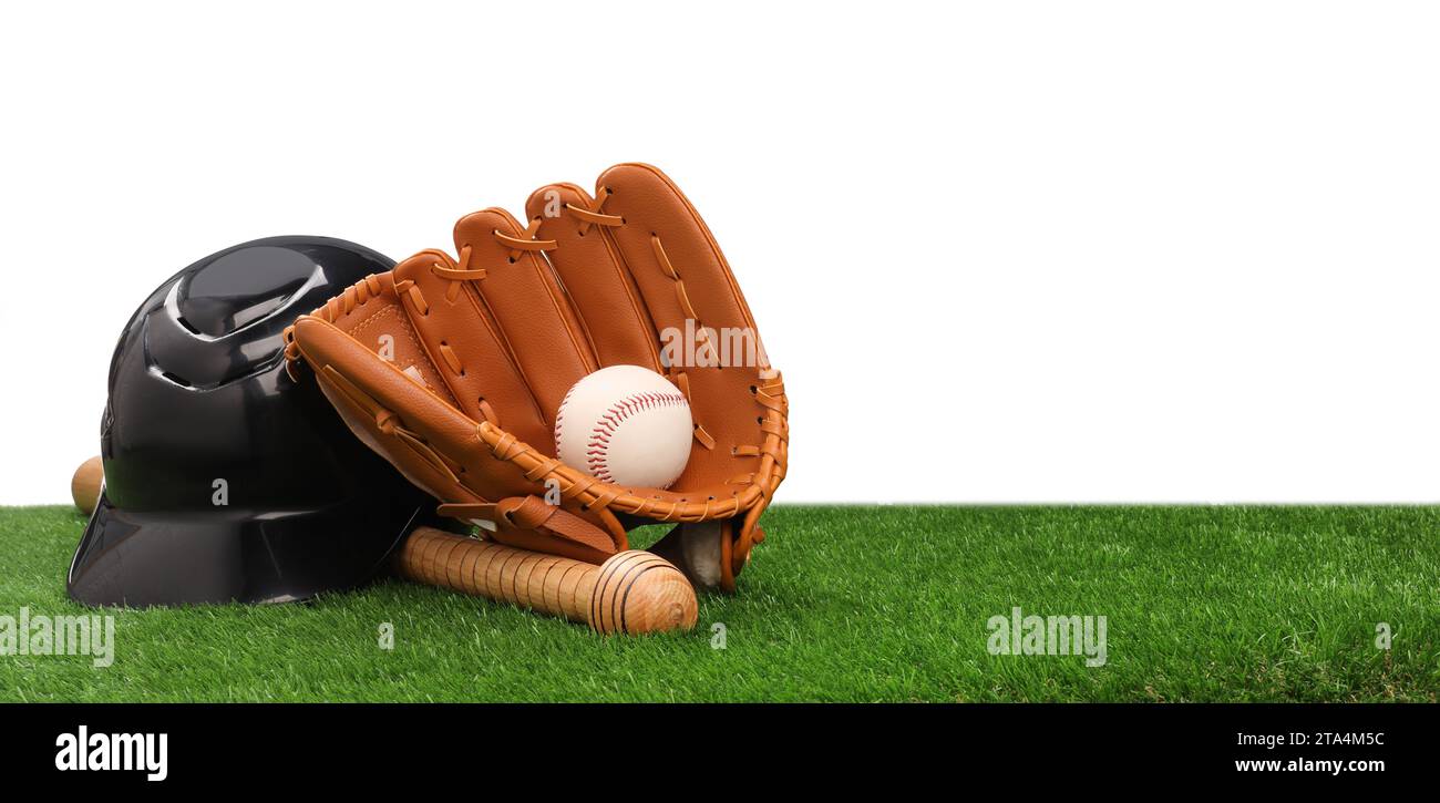 Baseball bat, ball, batting helmet and glove on artificial grass ...