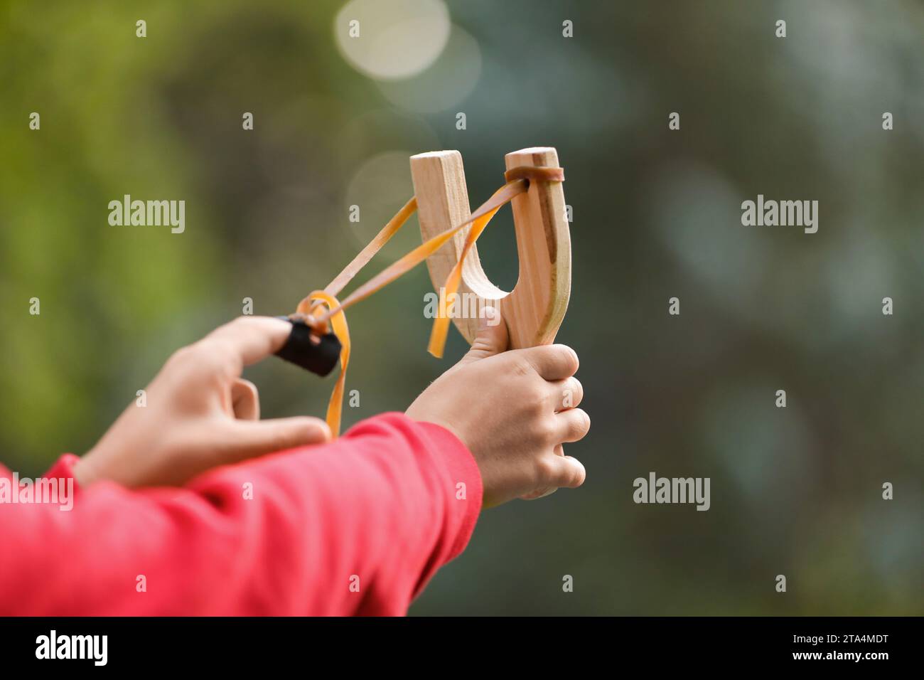 Little boy playing with slingshot outdoors, closeup Stock Photo - Alamy