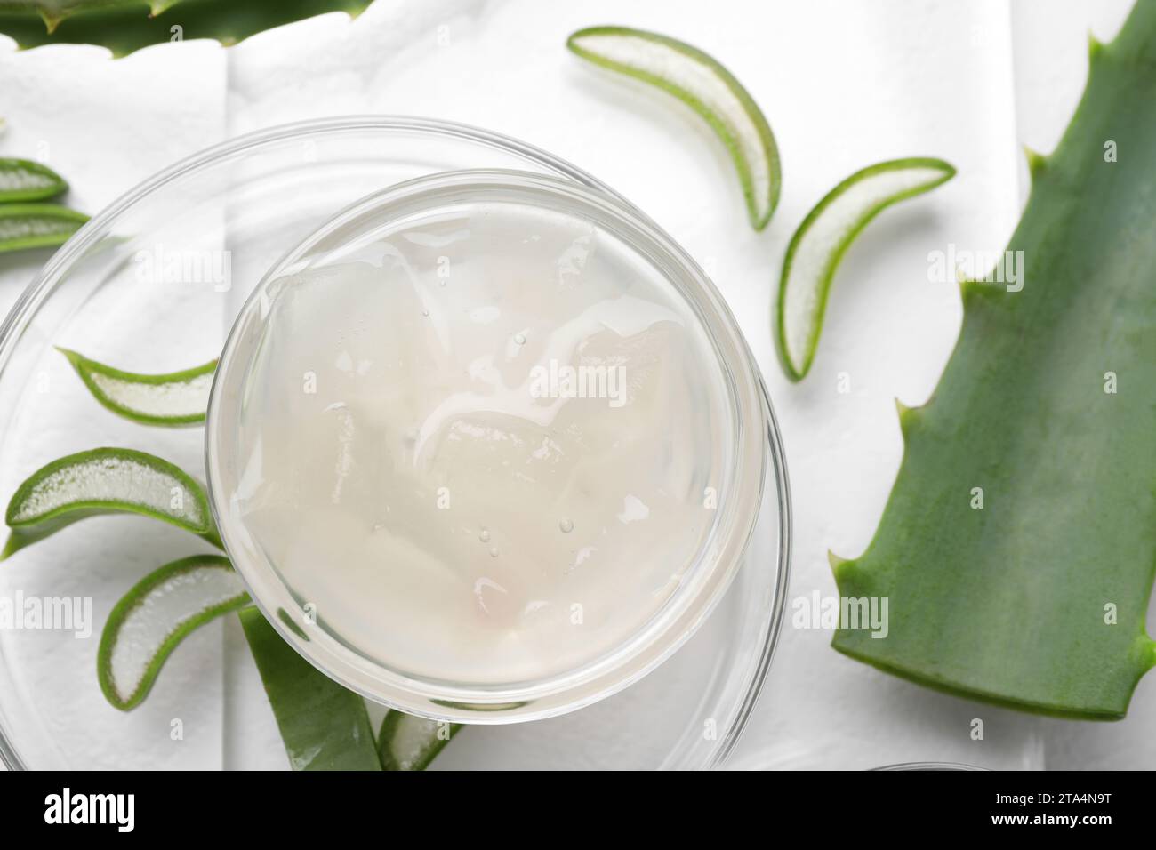 Aloe vera gel and slices of plant on white background, flat lay Stock ...
