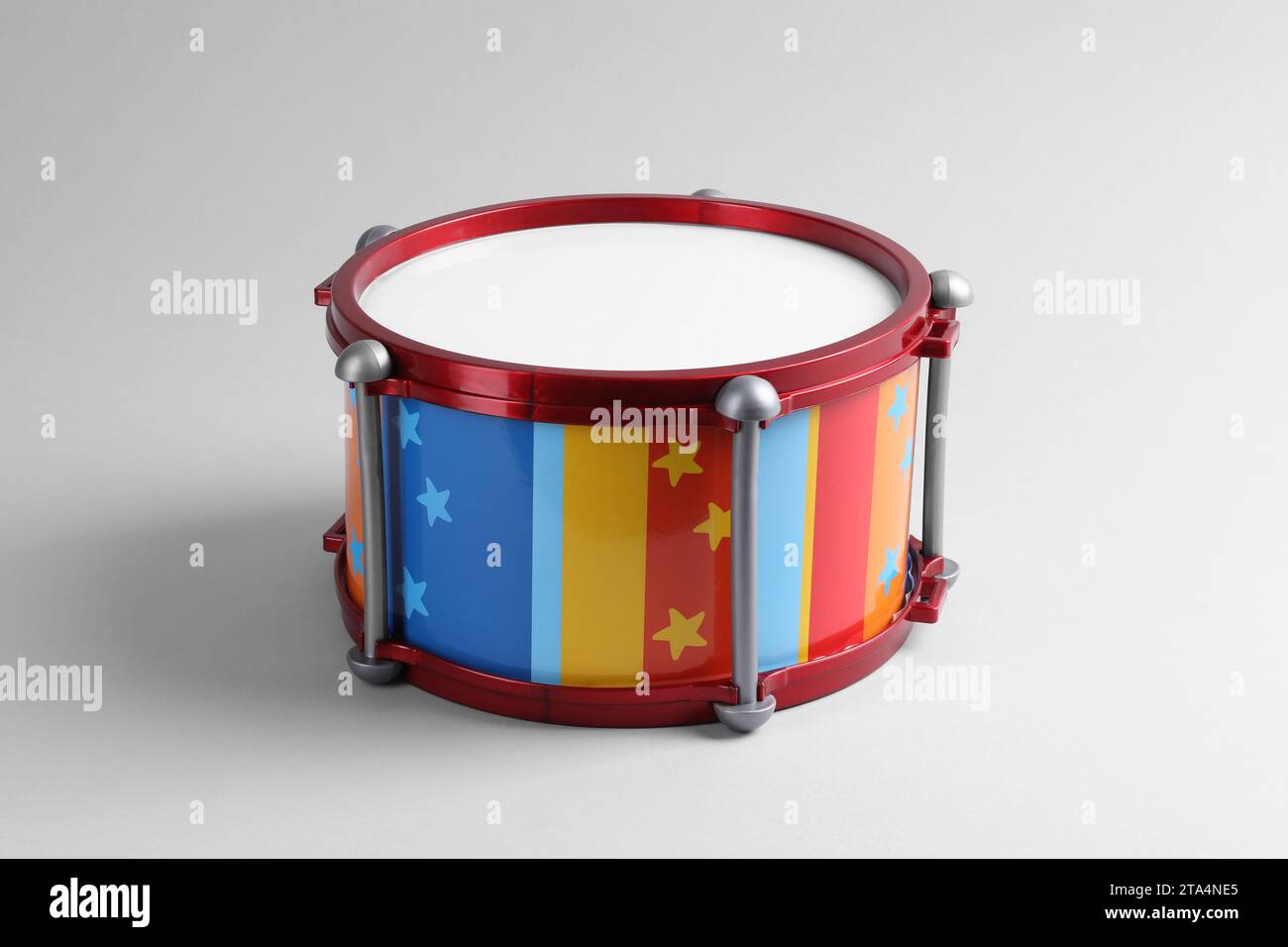 Colorful drum on light background. Percussion musical instrument Stock ...