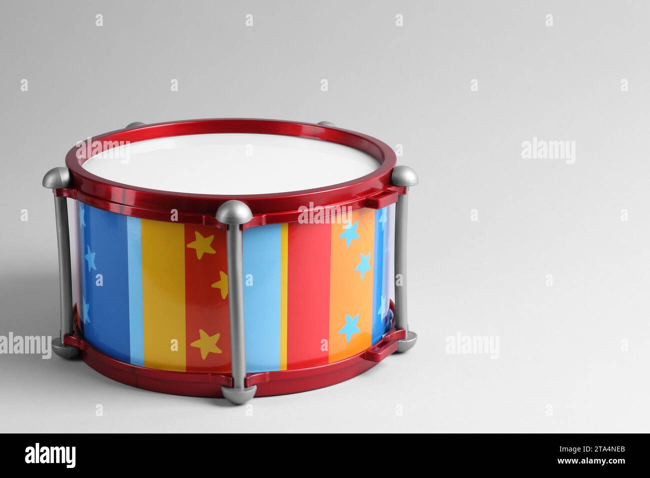 Colorful drum on light background. Percussion musical instrument Stock ...