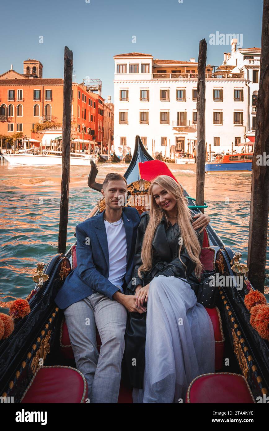 Romantic Couple Enjoying Traditional Gondola Ride Through Serene Canals