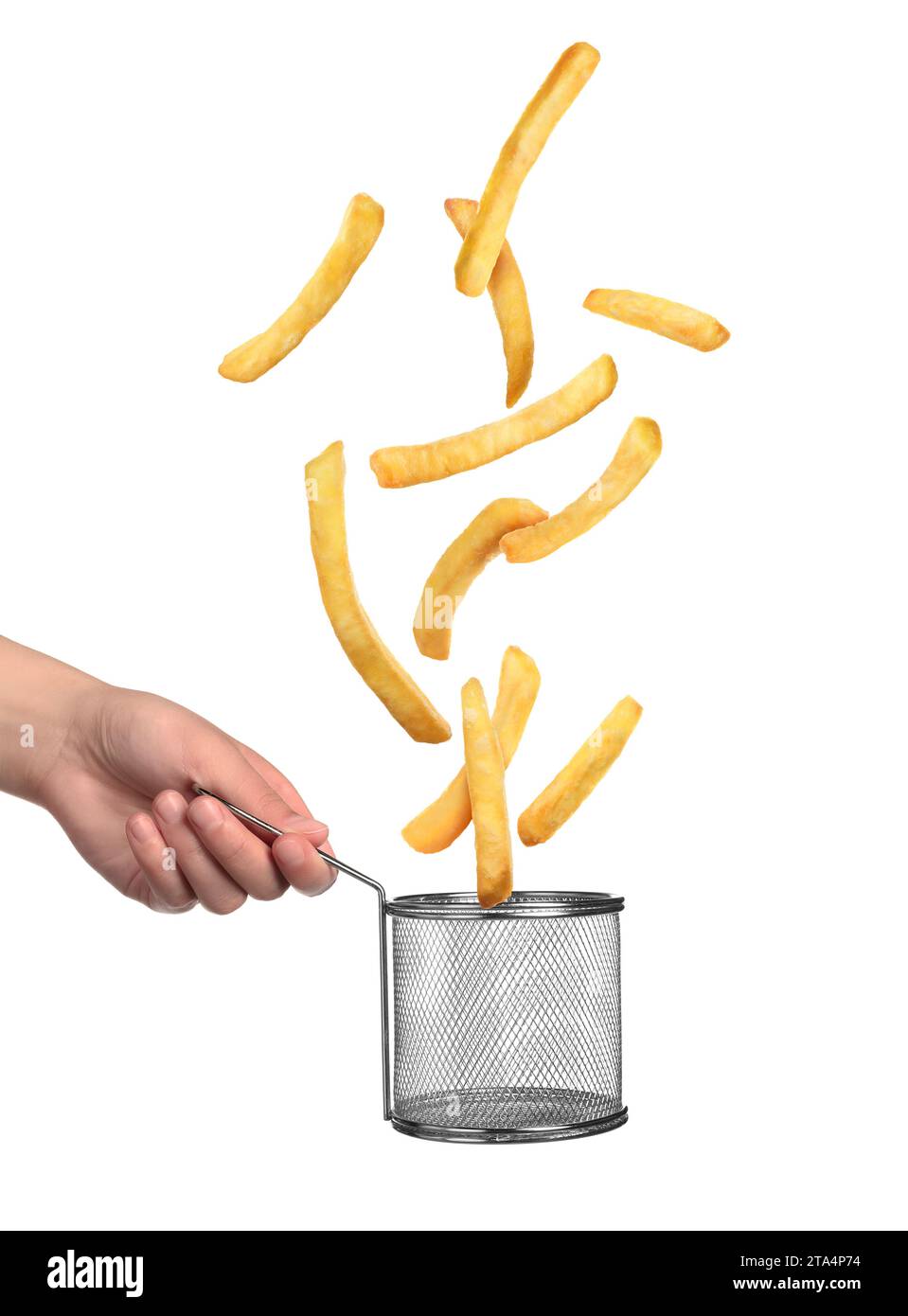 French fries falling into metal basket held by woman on white ...