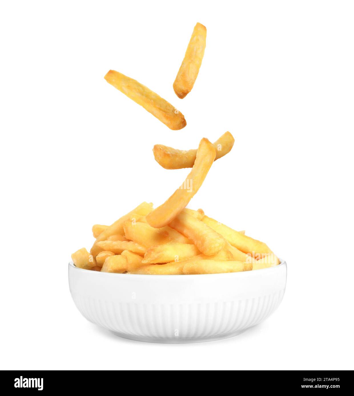 Tasty French fries falling into bowl on white background Stock Photo ...