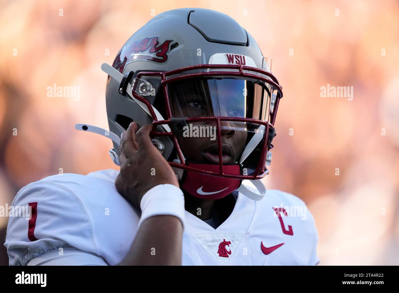 Washington State quarterback Cameron Ward walks off the field during ...