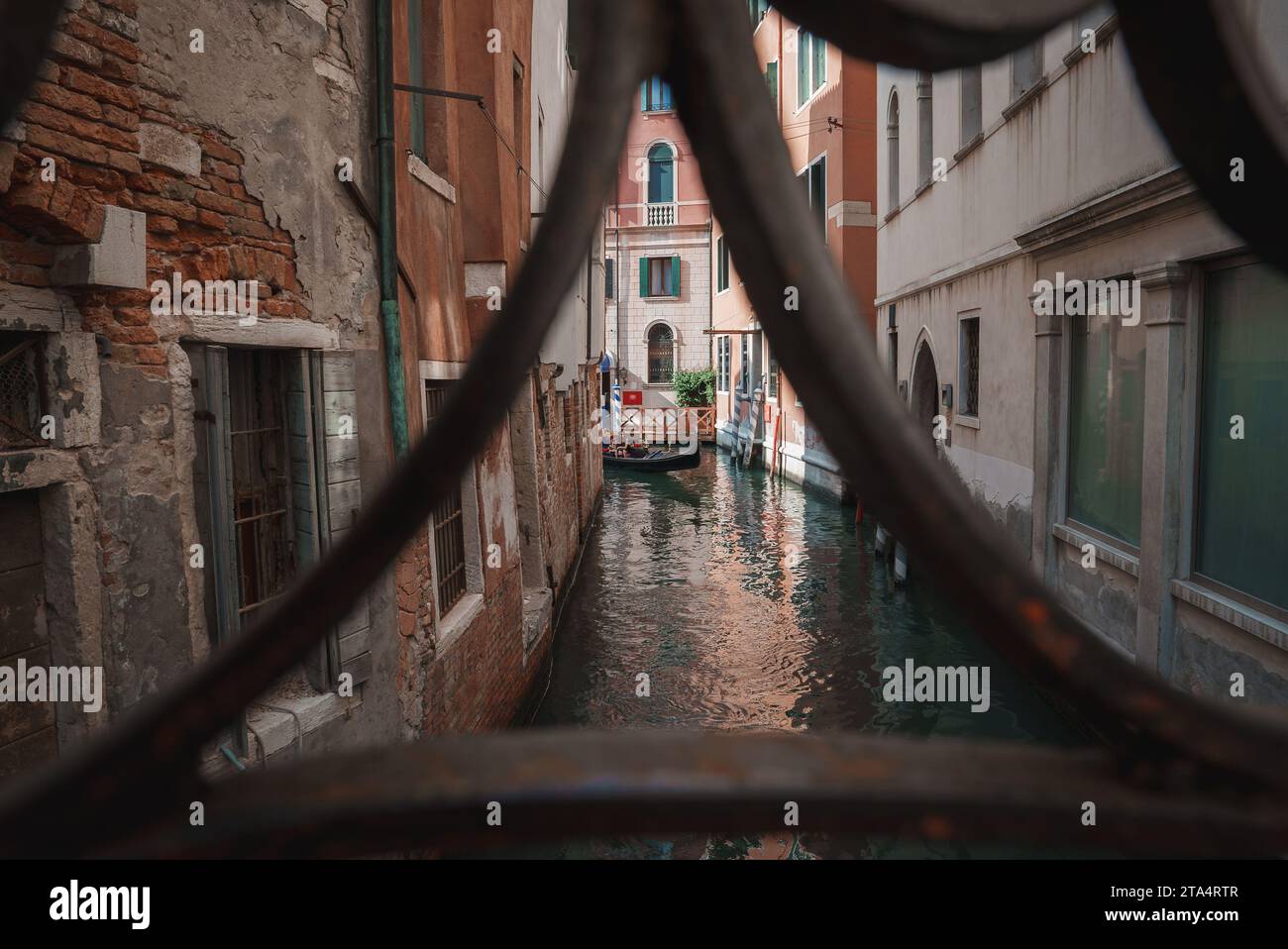 Scenic View of Canal in Venice, Italy Through Iron Gate on a Quiet Day ...