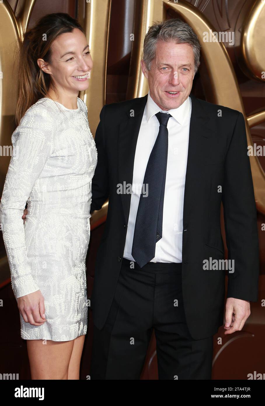 London, UK. 28th Nov, 2023. Anna Elisabet Eberstein and Hugh Grant ...