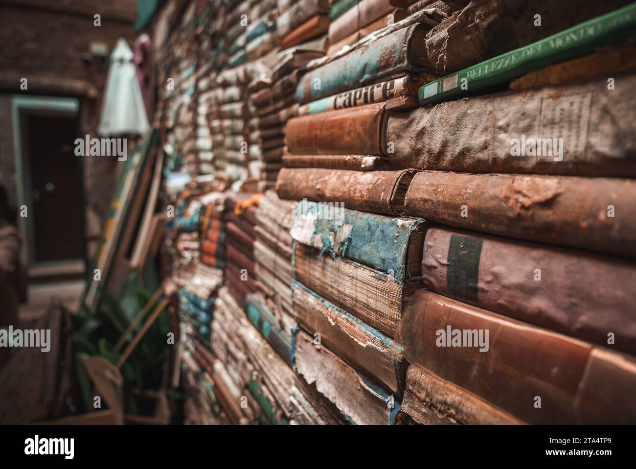 Vintage Book Stack Displayed on Wall in Venice, Italy - Old Library ...