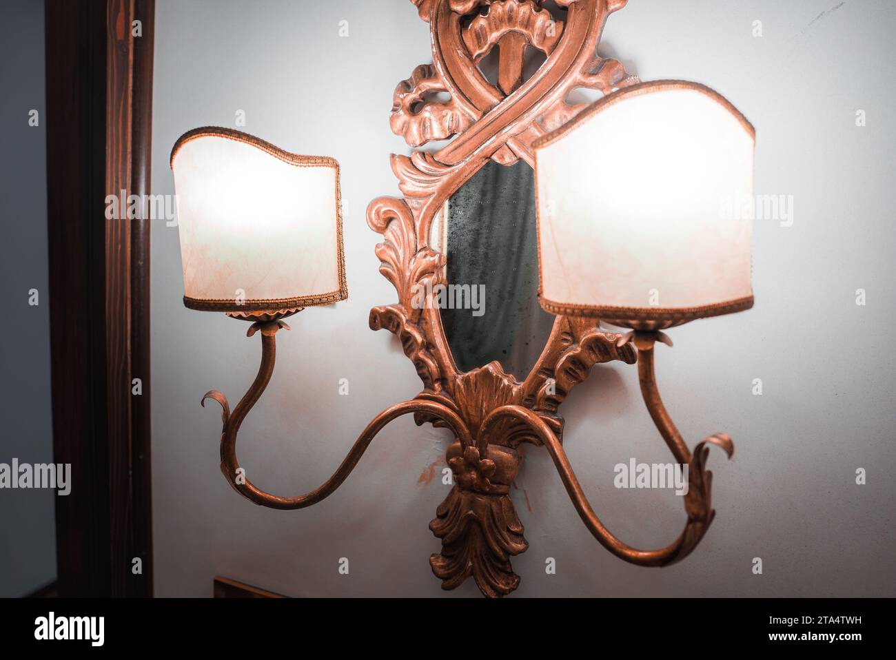 Medium-sized ornate metal wall light with intricate Baroque Rococo ...