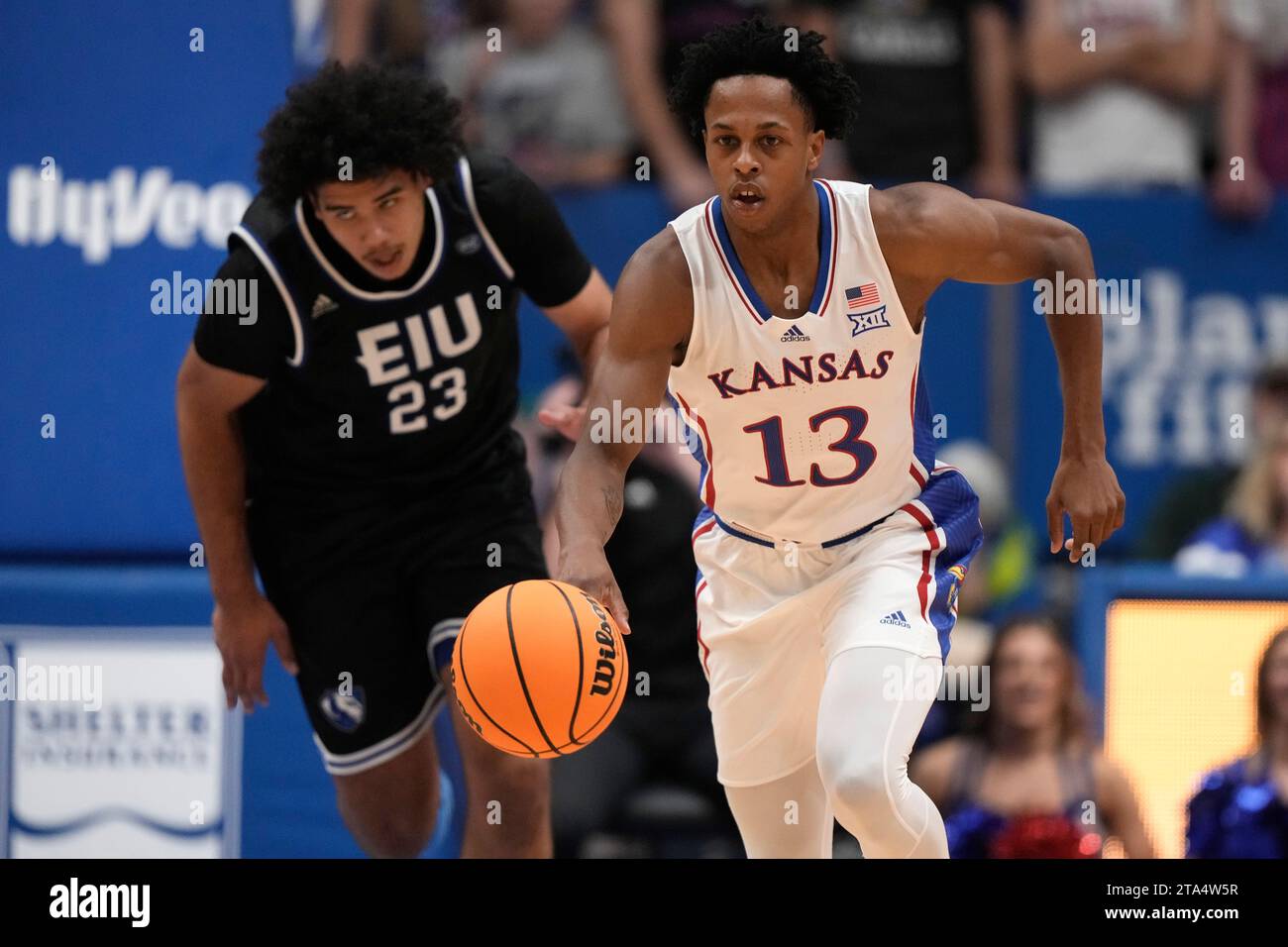 Kansas guard Elmarko Jackson (13) is chased by Eastern Illinois forward ...