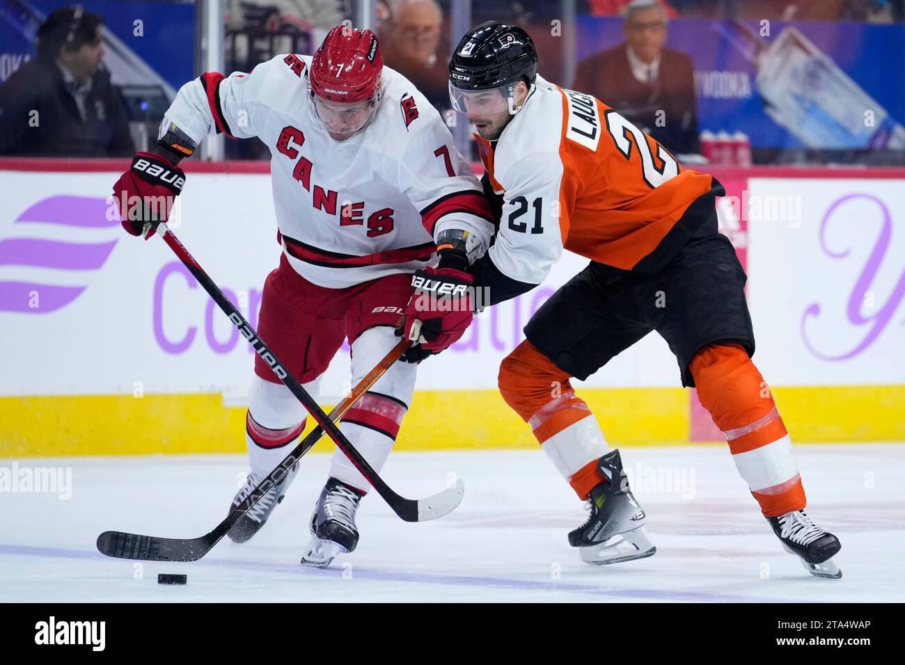 Carolina Hurricanes' Dmitry Orlov, left, and Philadelphia Flyers' Scott ...