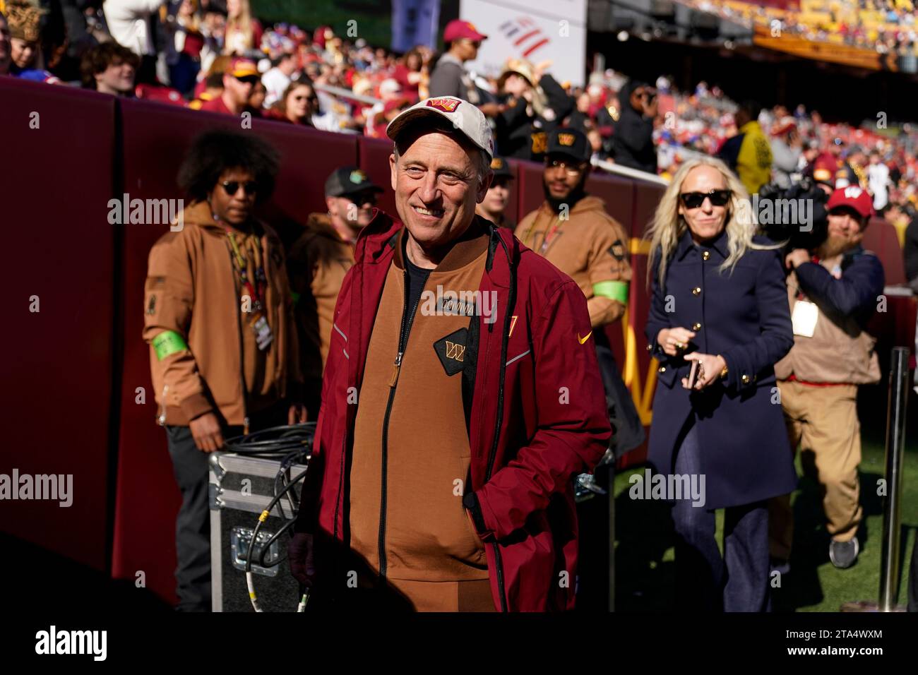 Washington Commanders team owner Josh Harris, center, and his wife ...